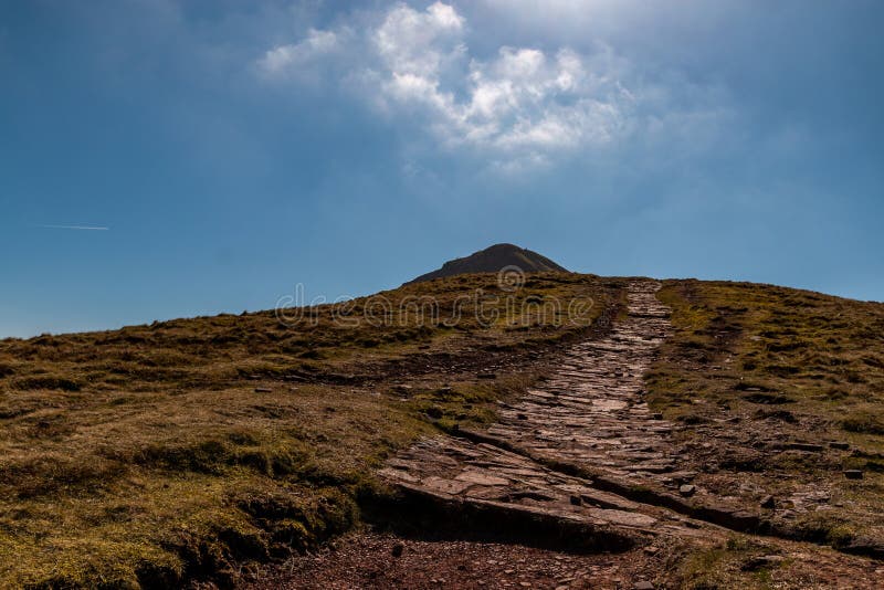 Stone path to mountain top stock photo. Image of walk - 215631116