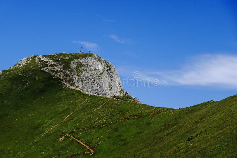 Summit Cross on a Rocky Green Steep Mountain with Blue Sky Stock Image ...