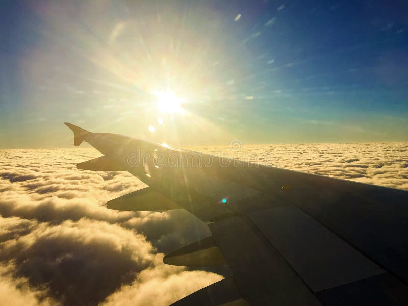 SUN ABOVE the CLOUDS in FLIGHT Stock Image - Image of beaming ...