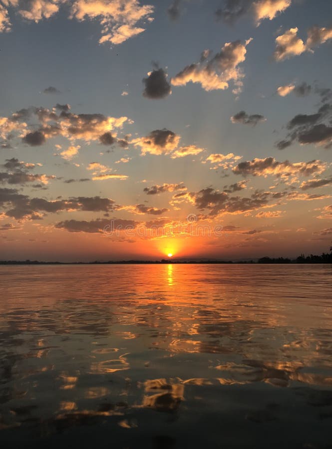 Sunset over River stock photo. Image of reflection, landscape - 181288998