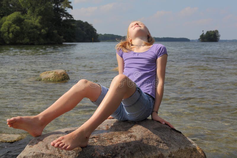 Sun bathing at the lake stock image. Image of enjoyment - 15810325