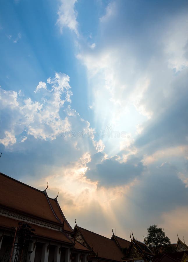Sun Beam Behind the Clouds Over the Buddhist Temple Stock Image - Image ...