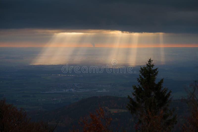 Sun beams over landscape stock image. Image of setting - 85155515