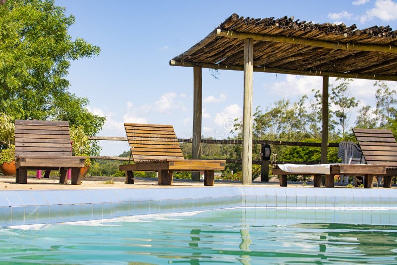 Sun Bed Near the Pool in the Resort, Vacation Stock Image - Image of ...