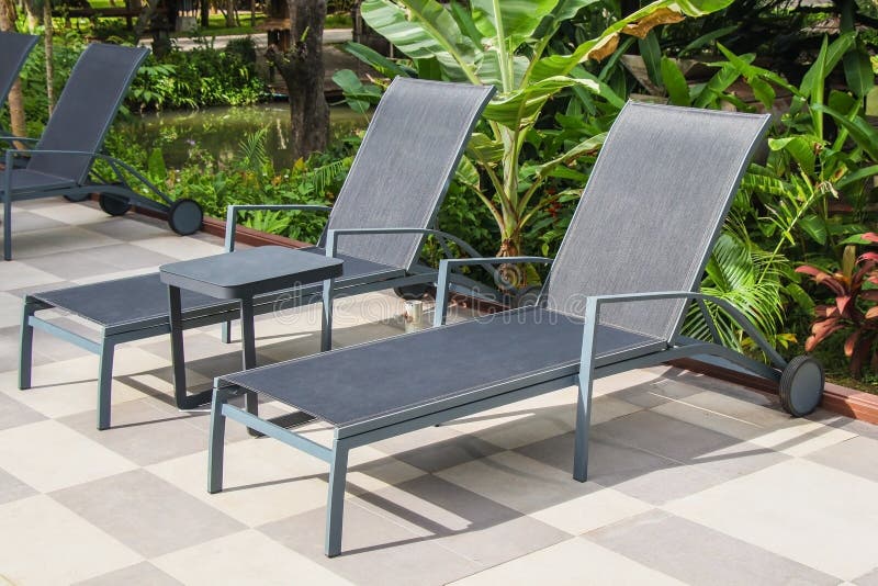 Sun bed beside the pool stock image. Image of blue, paradise - 193558157