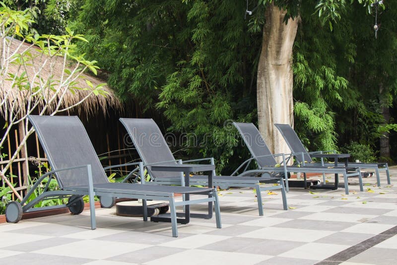 Sun Bed beside the Swimming Pool Stock Photo - Image of relaxation ...