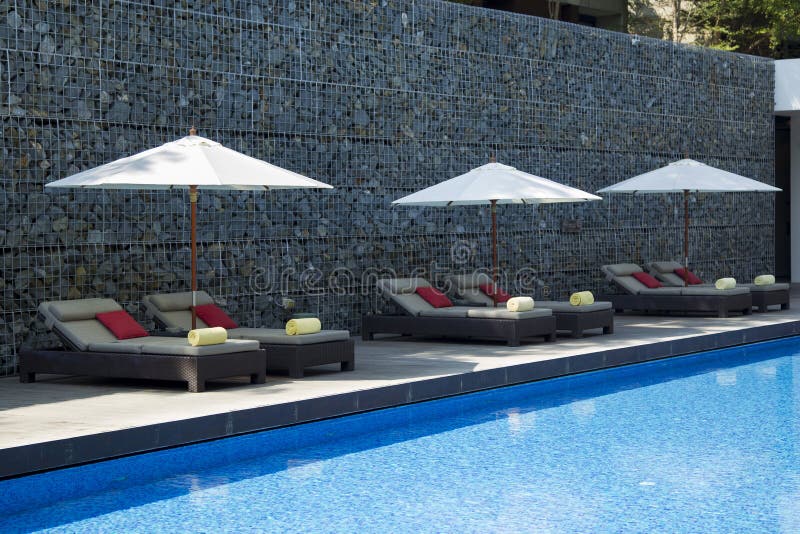 Sun Bed in Swimming Pool Area Stock Photo - Image of hotel, pool: 36790228