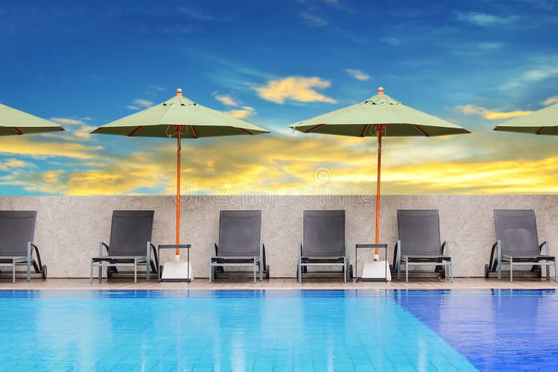 Sun Bed beside the Swimming Pool Stock Photo - Image of deck, holiday ...