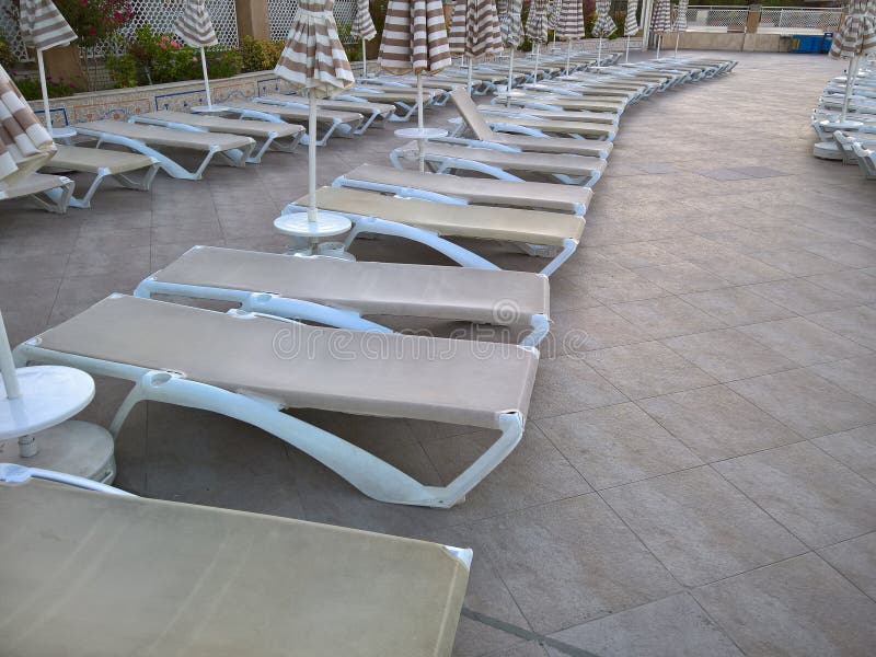Sun Beds by the Beach and Swimming Pool Stock Image - Image of chair ...