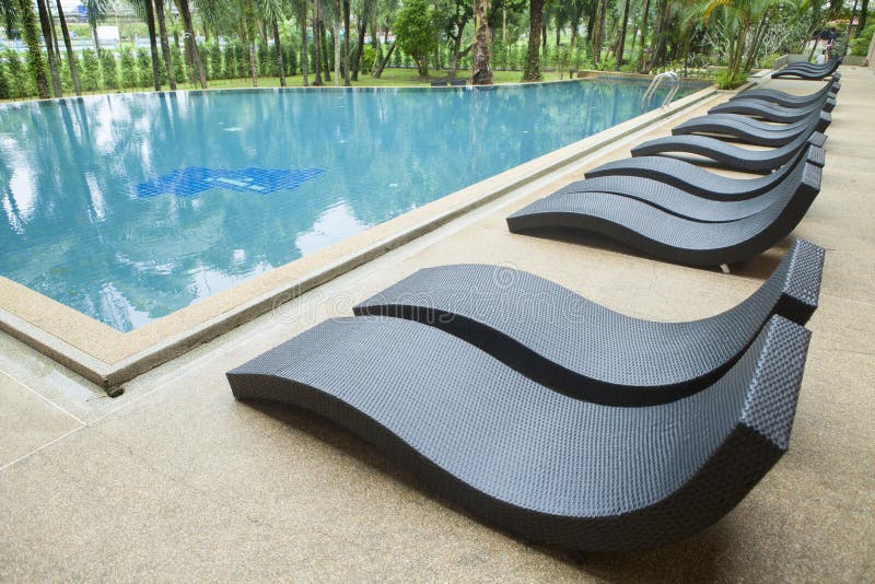 Sun Beds Near a Swimming Pool Stock Image - Image of deckchair ...