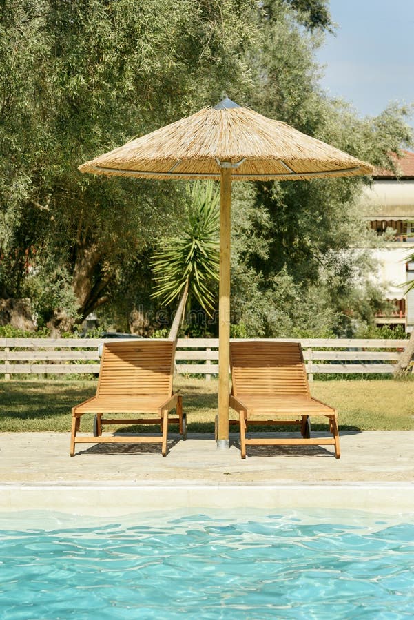 Sun beds and parasol stock image. Image of olive, parasol - 87103155