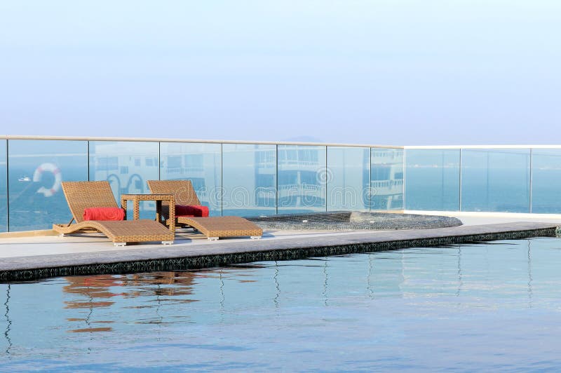 Sunbeds by the pool stock image. Image of relax, seascape - 26119131