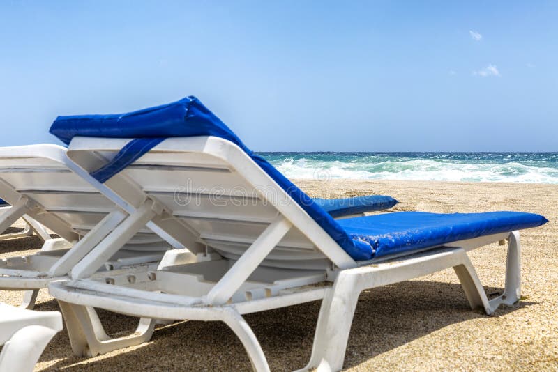 Sun Beds on the Sandy Beach. Turquoise Sea, Beautiful Landscape Stock ...