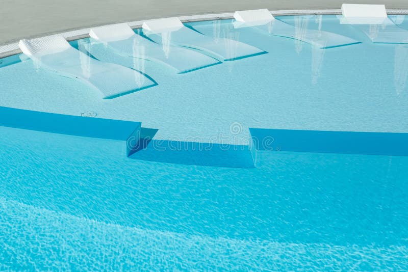 Sun Beds. Sun Beds in the Water. Swimming Pool Stock Image - Image of ...
