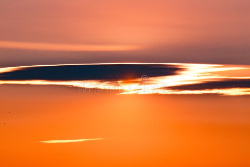 Sun Behind a Cloud: Globe of Fire Perfectly Visibile Stock Photo ...