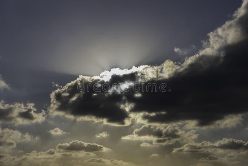 The Sun Behind Clouds at Sunset Time Stock Image - Image of clouded ...