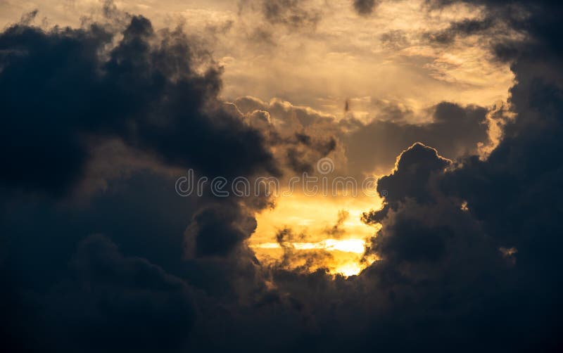 Sun Behind Dark Clouds. Dramatic Sunrice in Winter. Stormy Clouds Stock ...