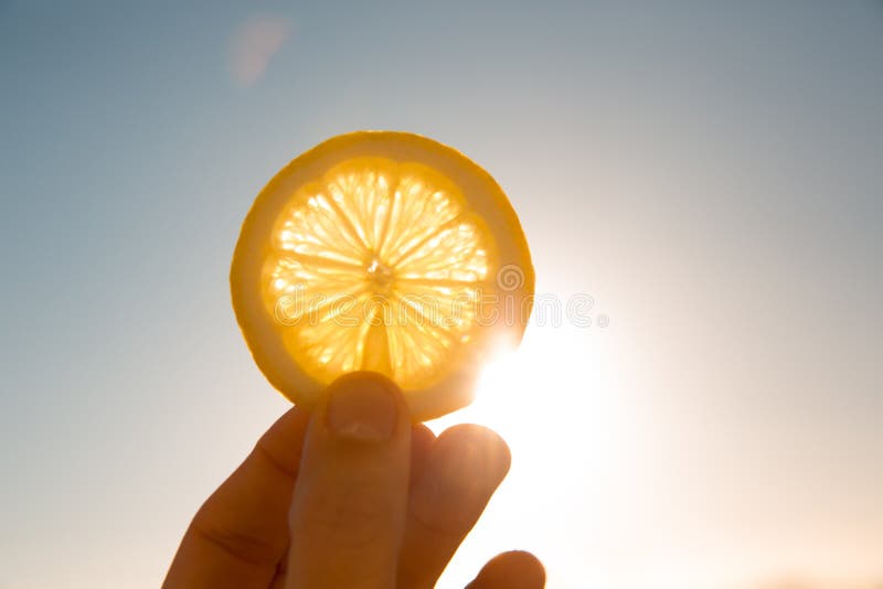Sun behind lemon slice stock image. Image of wooden - 111342117