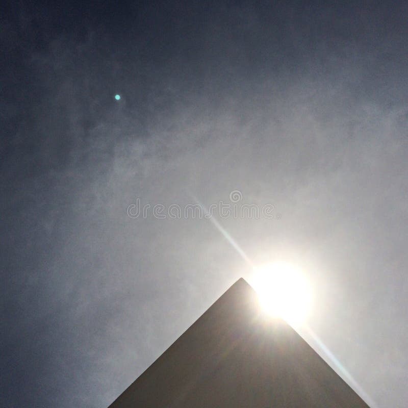 Sun behind a triangle stock image. Image of triangle - 53583535