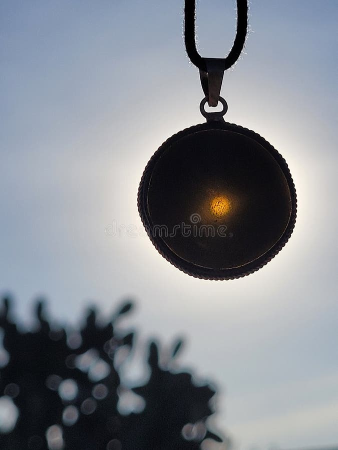 The Sun through a Black Obisidian Stone Stock Image - Image of iron ...