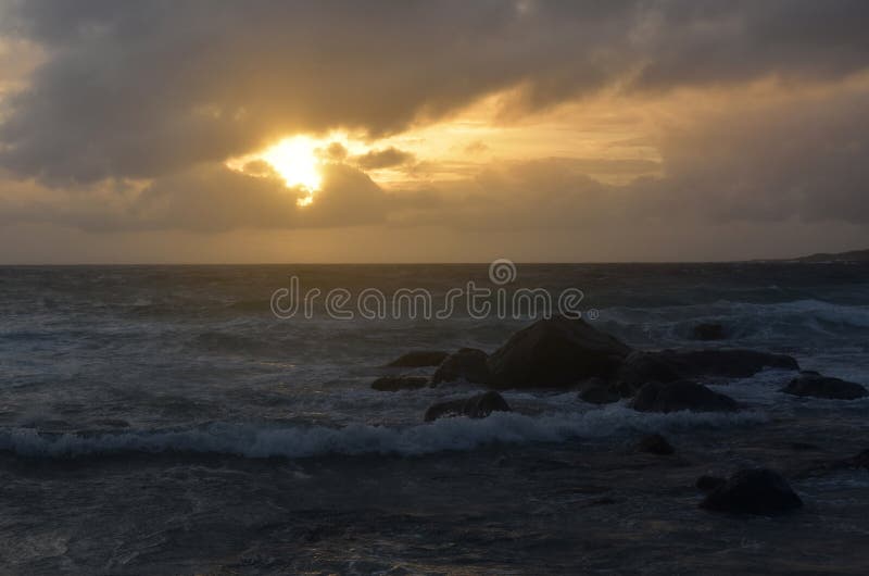 Sun Breaking through the Clouds in Aruba at Dawn Stock Photo - Image of ...