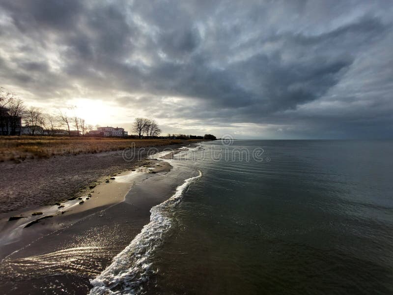 The Sun is Breaking through Clouds at the Beach of the Baltic Sea in ...