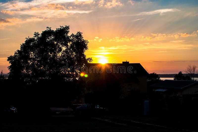 Sun Breaking through the House, Rays of Sun, Clouds Stock Image - Image ...
