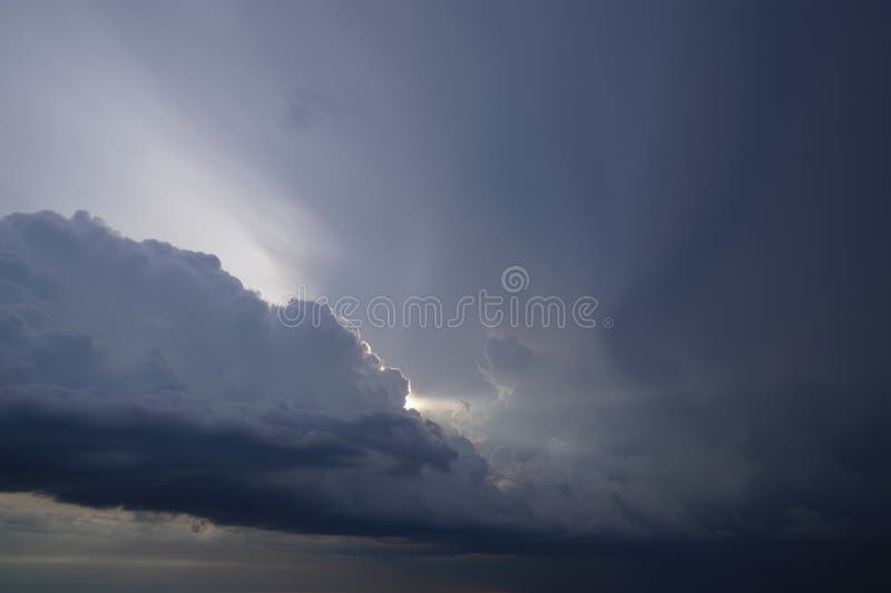 The Sun Breaks through the Clouds, Casting an Awe-inspiring Light on a ...