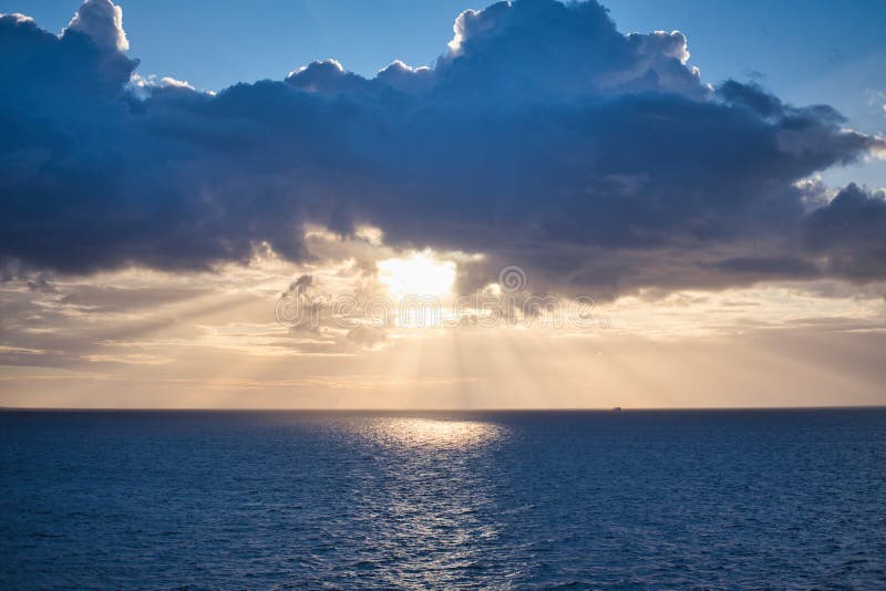 Sun Breaks through Clouds and Leaves Spotlight Stock Image - Image of ...