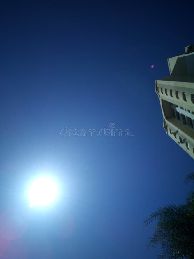 Sun on building stock photo. Image of building, tree - 128572952