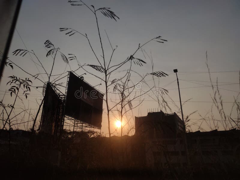 Sun in between Building and Hordings in City Stock Photo - Image of ...