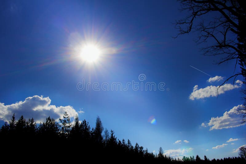 Sun Burst. the Afternoon Sun is Burning. Blue Sky and a Few White ...