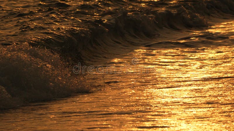 Golden Sunset Over Rippling Waves Stock Video - Video of light, sunset ...