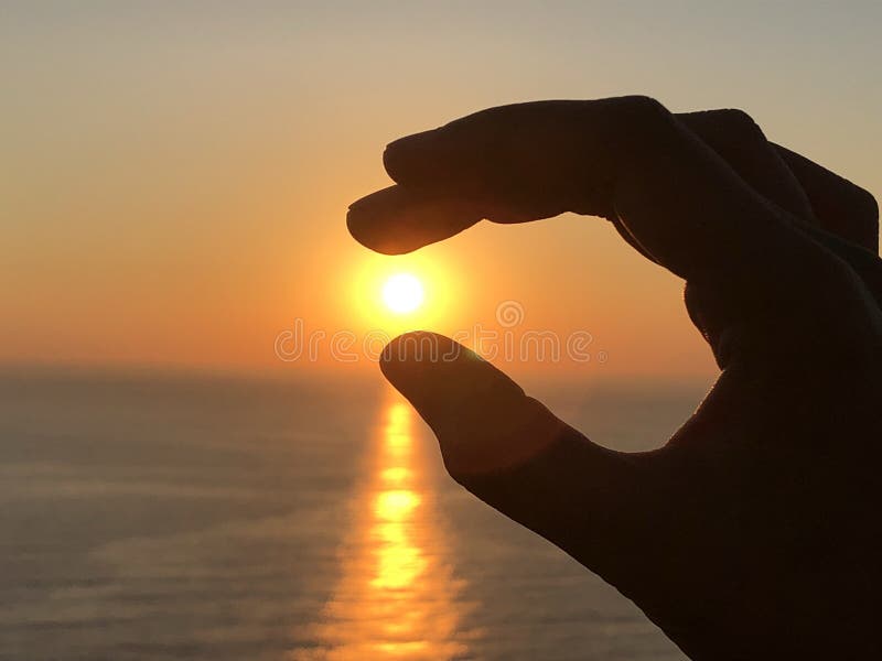 Sun Caught in between Finger Tips Stock Image - Image of tips, hand ...