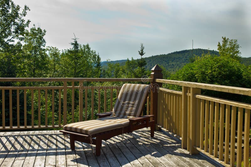 Sunbathing Chair on a Wooden Deck Stock Photo - Image of relaxation ...