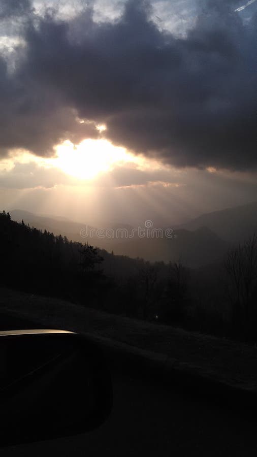 Sun through Clouds Over Mountains and Valleys Stock Photo - Image of ...