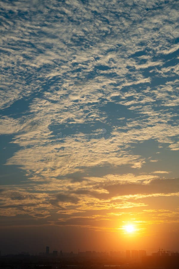 Sun and Clouds in the Sunset Time at Vertical Composition Stock Image ...