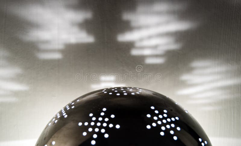 The Sun in a Colander. Rays of Light through the Holes Stock Image ...