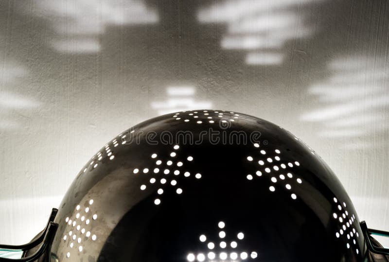 The Sun in a Colander. Rays of Light through the Holes Stock Image ...