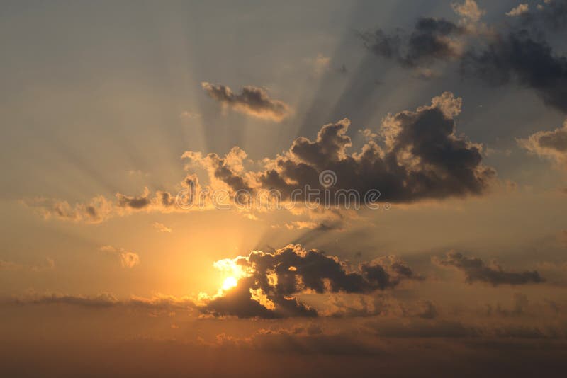 The Sun Coming Out of the Clouds at Dawn Stock Photo - Image of golden ...