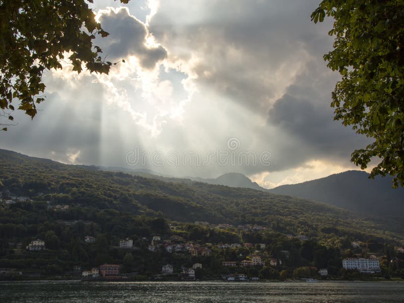 Sun coming out of clouds stock photo. Image of blue - 178912920