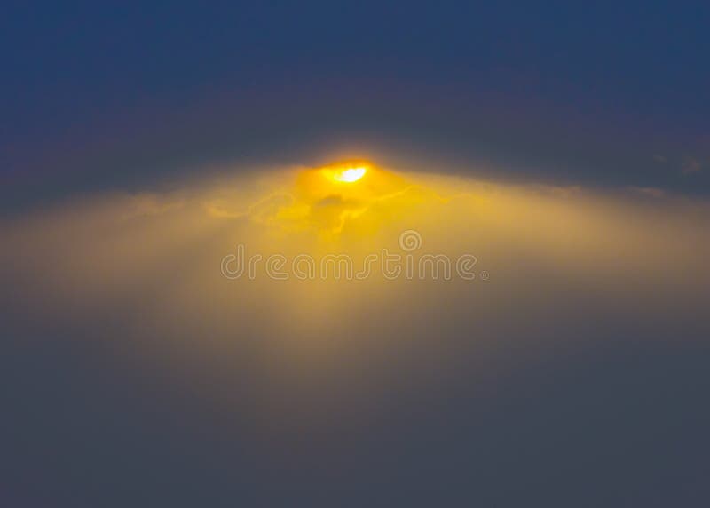 Sun coming out of clouds stock image. Image of light - 225618223