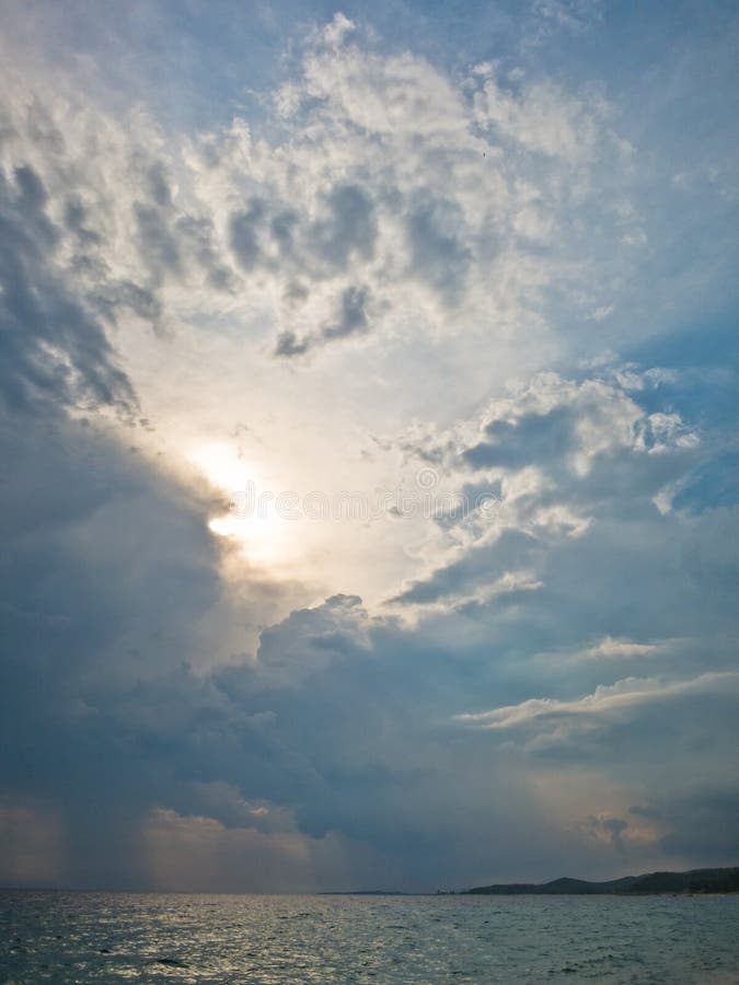 Sun is Coming Out at Sea after the Storm in Sithonia Stock Image ...