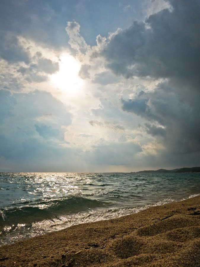 Sun is Coming Out at Sea after the Storm in Sithonia Stock Image ...