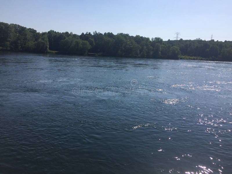 Sun Dappled Cold River stock image. Image of river, horizon - 182886783