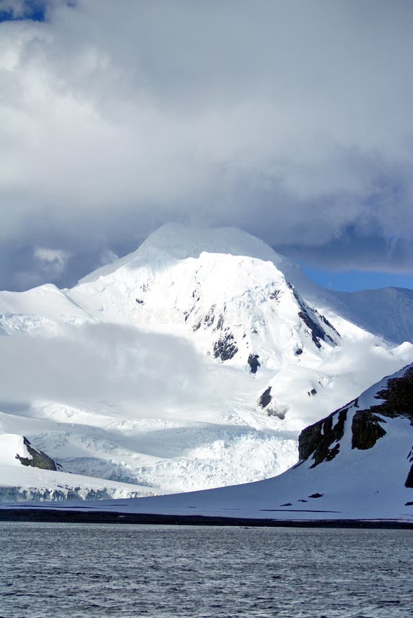 Sun Dappled Mountain in Antarctica with the Ocean in the Foreground ...