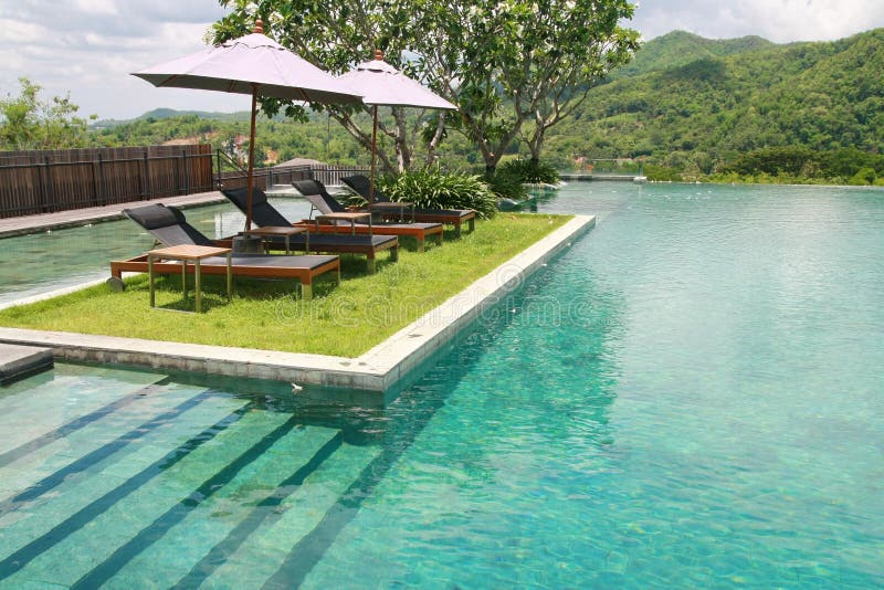 Sun deck and swimmingpool stock photo. Image of forest - 34894806