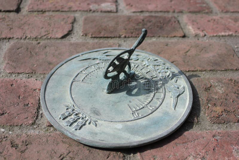 Sun dial on bricks stock photo. Image of bricks, clock - 51863778