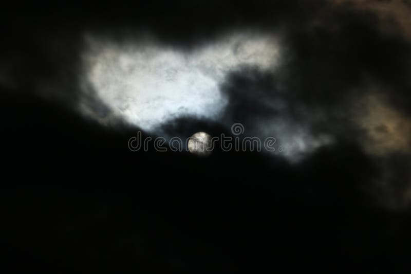 Sun Disk Behind Backlit Clouds Stock Image - Image of light, cloud ...