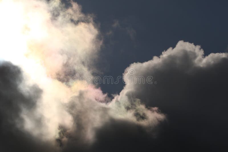 Sun Disk Behind Backlit Clouds Stock Photo - Image of form, moody ...